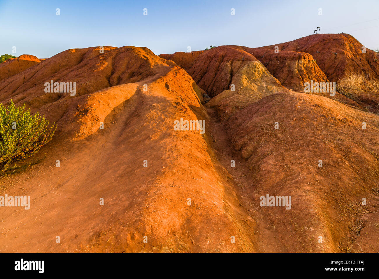 red soils around the freshwater lake formed in a former quarry for the ...
