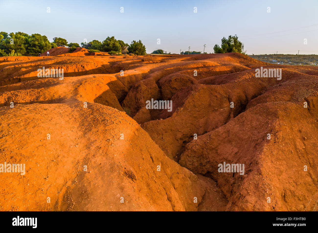 red soils around the freshwater lake formed in a former quarry for the ...