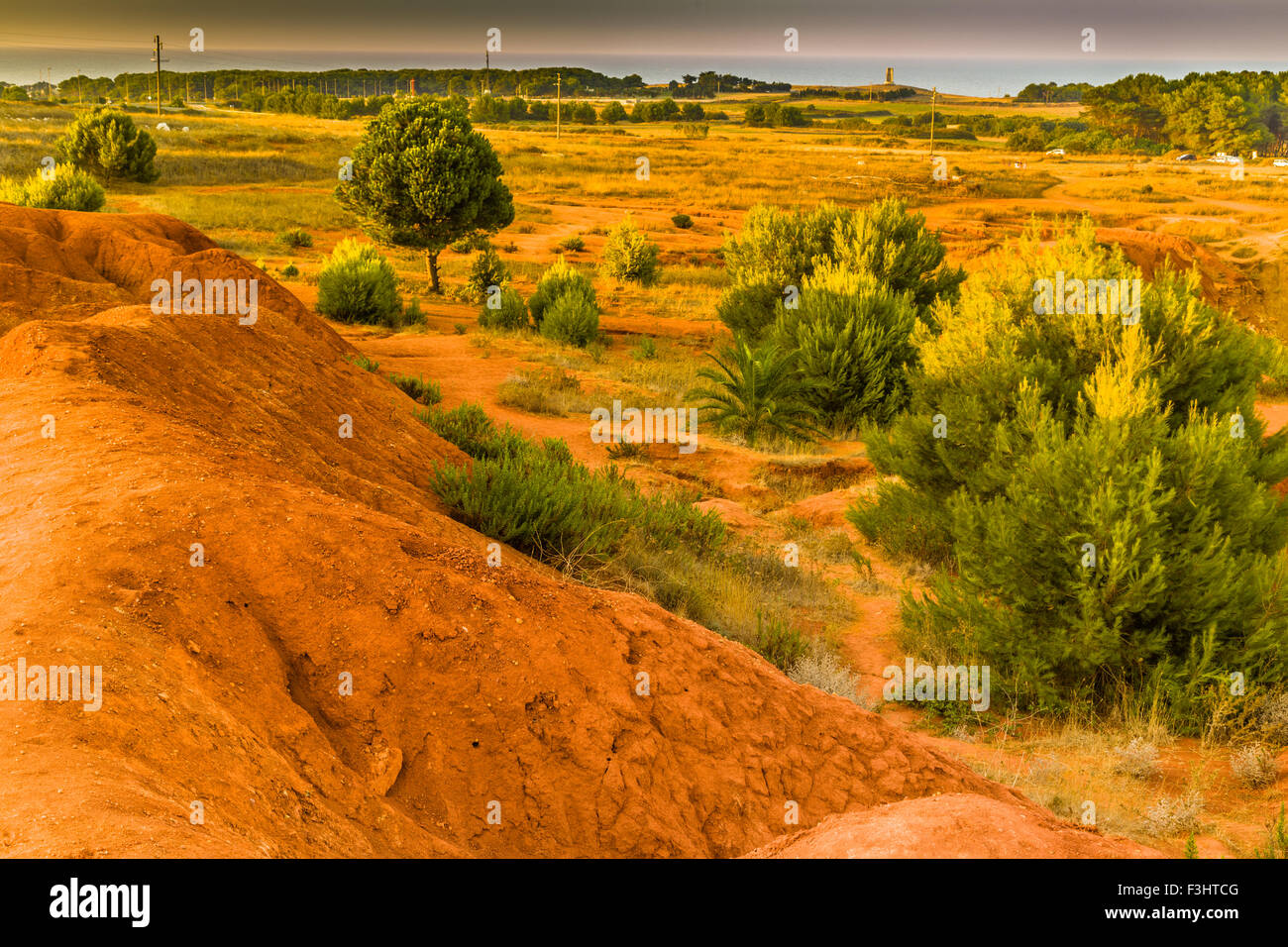 red soils around the freshwater lake formed in a former quarry for the ...
