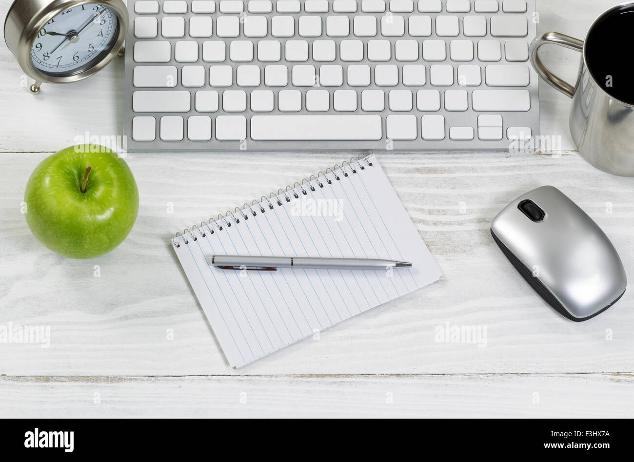 Top view of organized white wooden desktop with office work objects ...