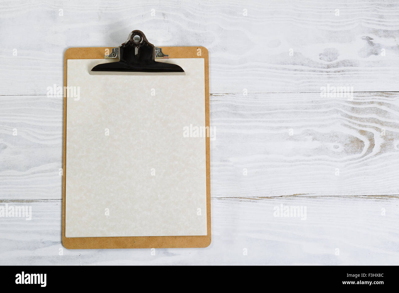 Top view of clipboard and blank paper on white desktop Stock Photo - Alamy