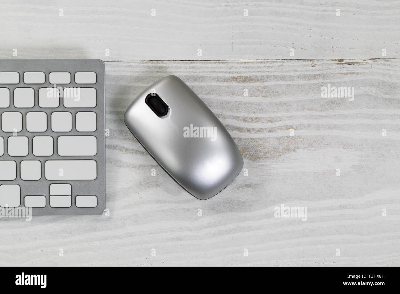 White desktop with partial keyboard and mouse. Horizontal layout with ...