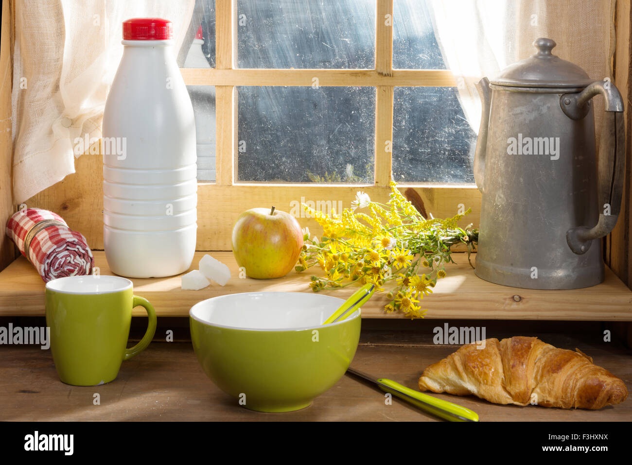 Breakfast with milk, croissant, and apple Stock Photo - Alamy