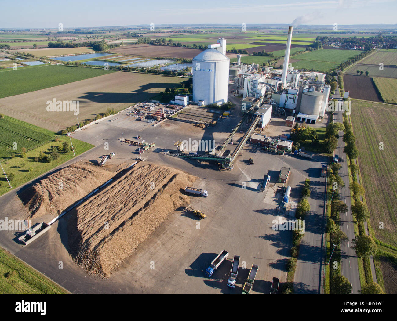 Mounds of harvested sugar beets from the beet fields at the factory of ...