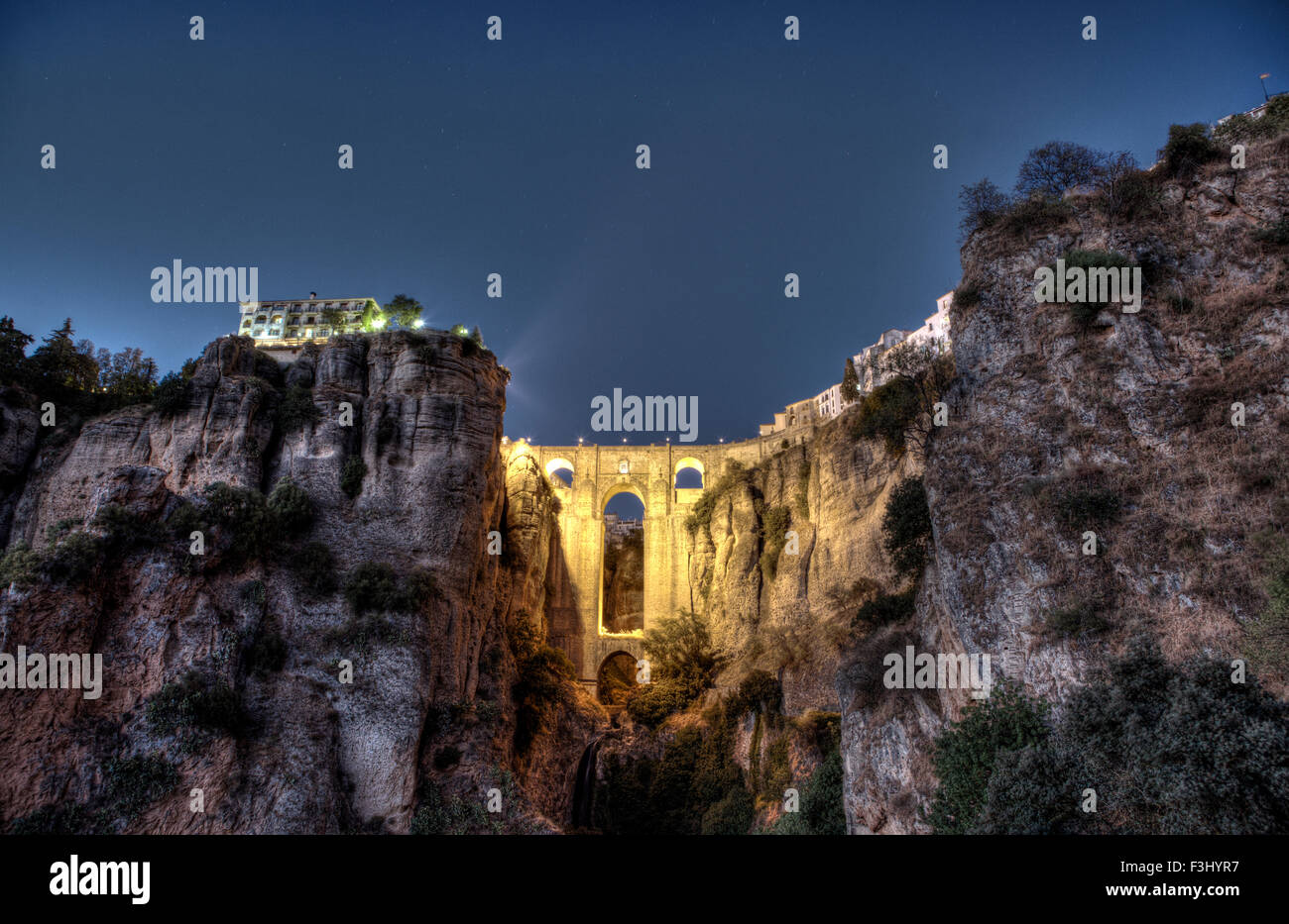 Illuminated puente nuevo bridge from outskirts of ronda at sunset hi-res stock photography and ...