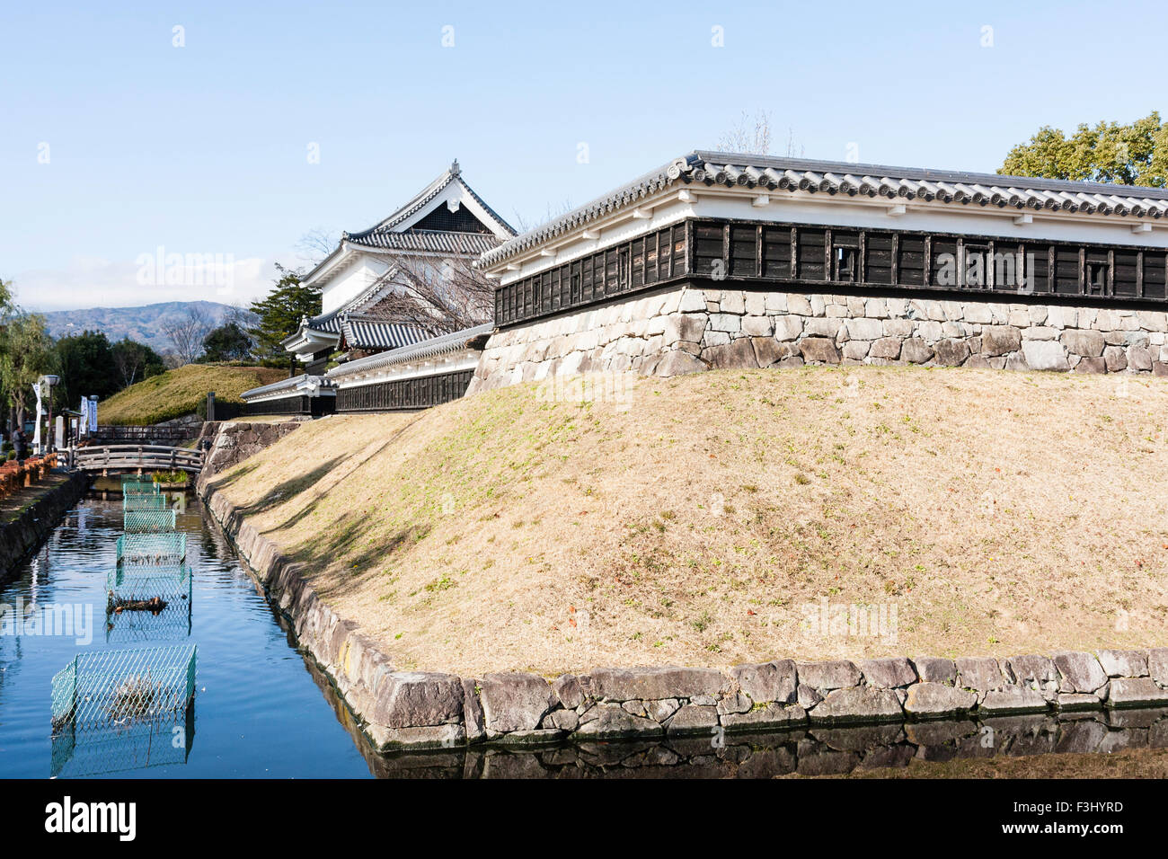 Japan, Shoryuji castle, Kyoto. Corner view of moat and dobei wood and ...