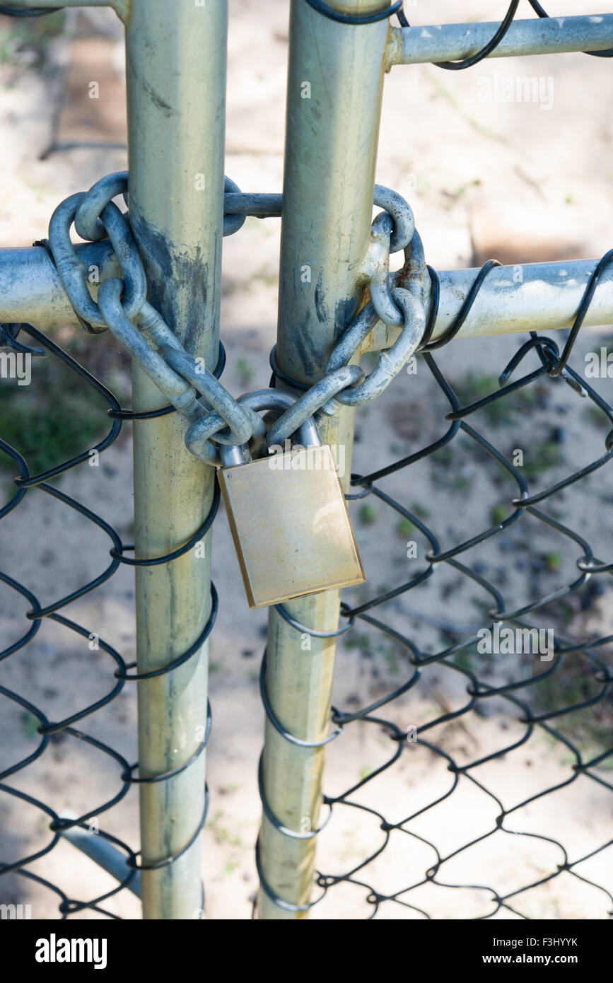 Padlock on fence Stock Photo - Alamy