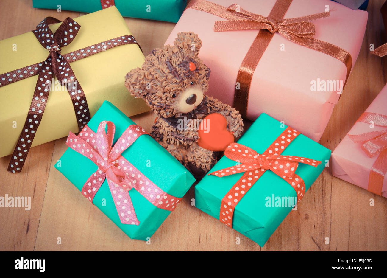 Vintage photo, Teddy bear and wrapped colorful gifts for Christmas ...
