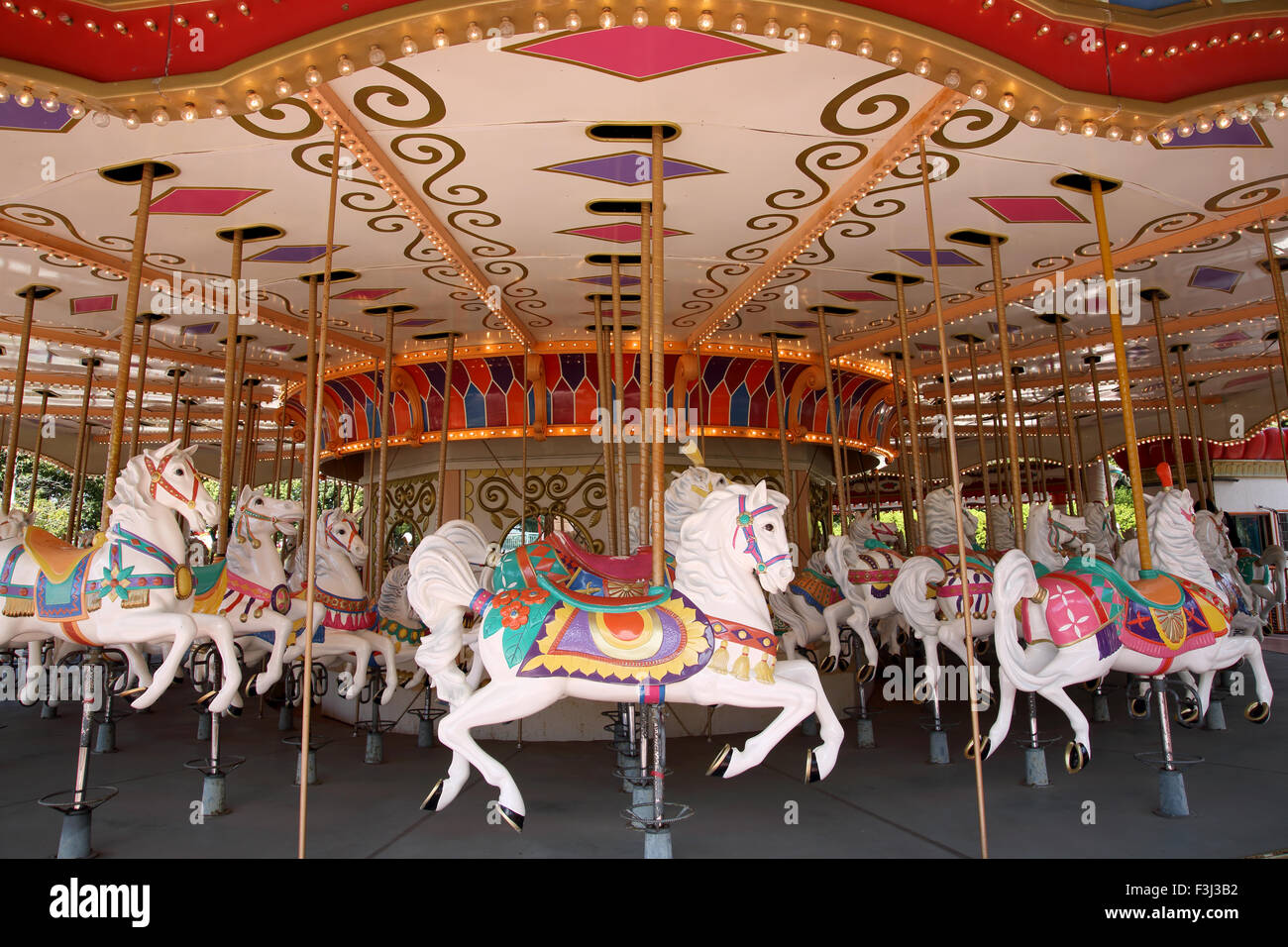 Empty carousel merry go round park attraction Stock Photo - Alamy