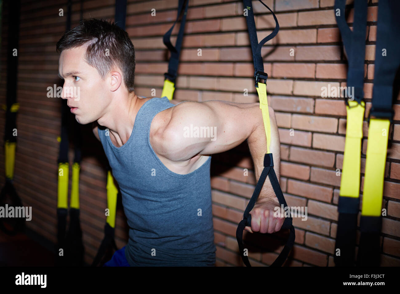 Muscular man exercising in gym Stock Photo - Alamy
