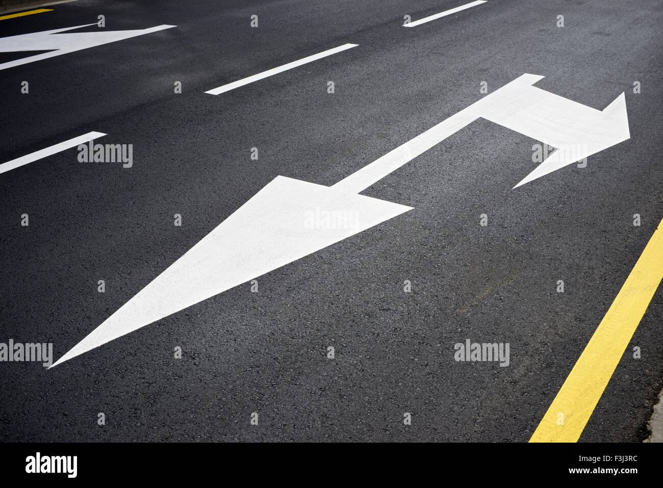 Traffic signs painted on the road Stock Photo - Alamy