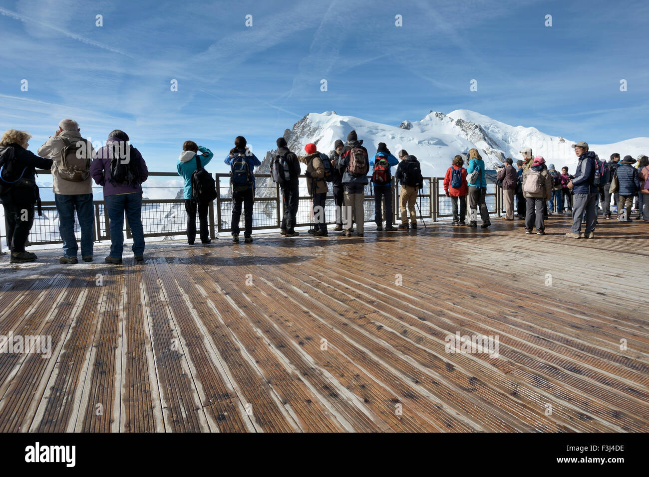 Tourist on a viewing platform, Aiguille du Midi, Mont Blanc Massif ...