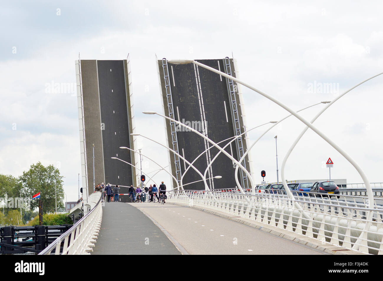 Bascule type bridge lifted with crowd waiting to pass Stock Photo - Alamy
