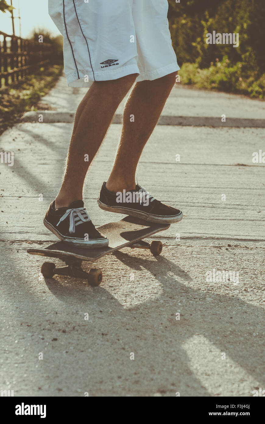 Young man skateboarding in the summer Stock Photo - Alamy
