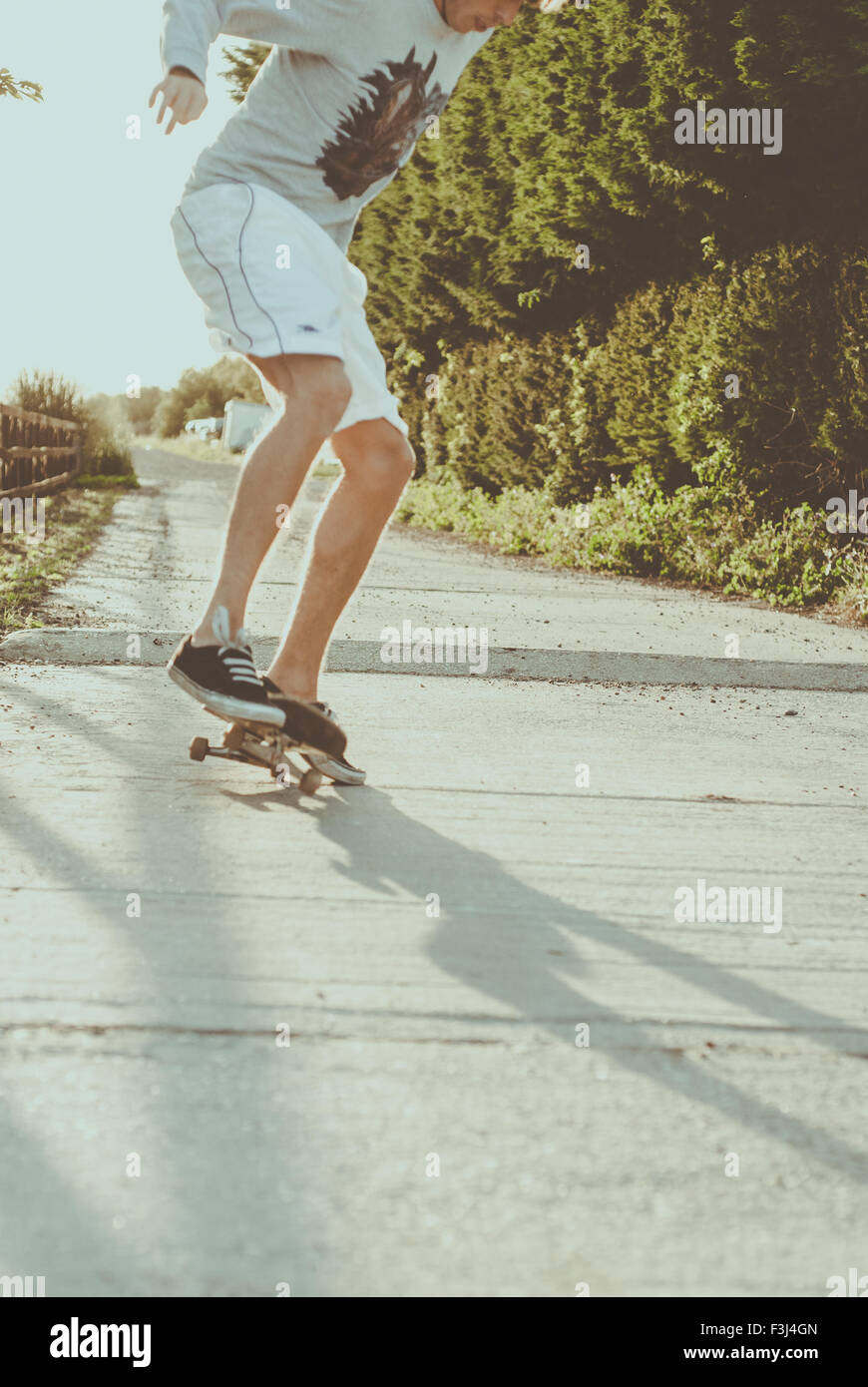 Young man skateboarding in the summer Stock Photo - Alamy
