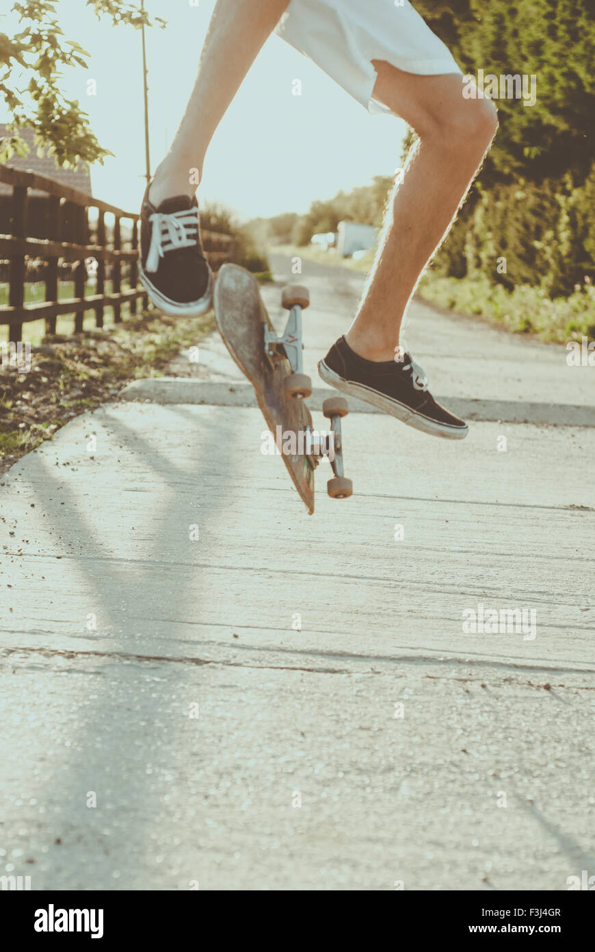 Young man skateboarding in the summer Stock Photo - Alamy