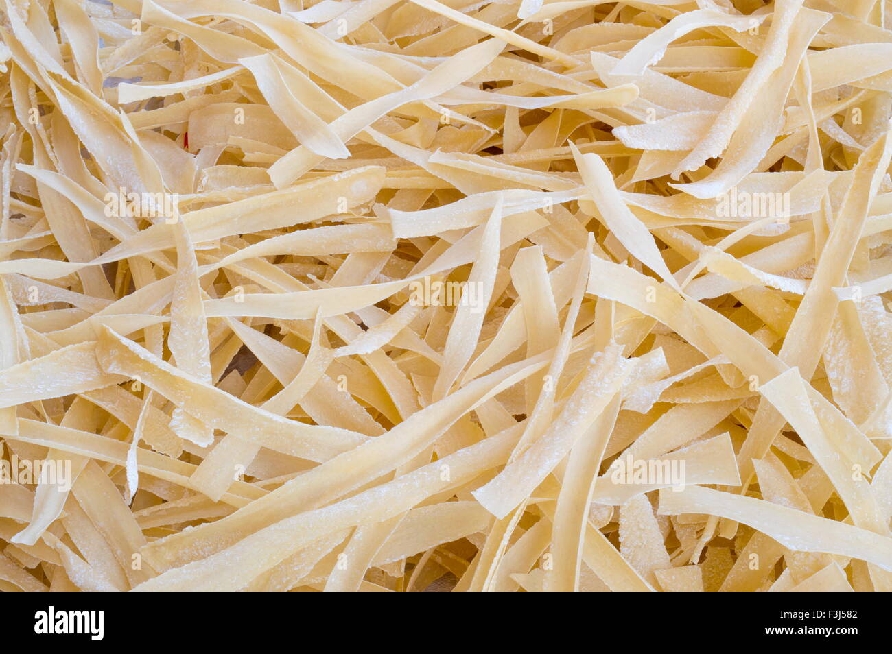 Homemade pasta drying on the balcony Stock Photo - Alamy