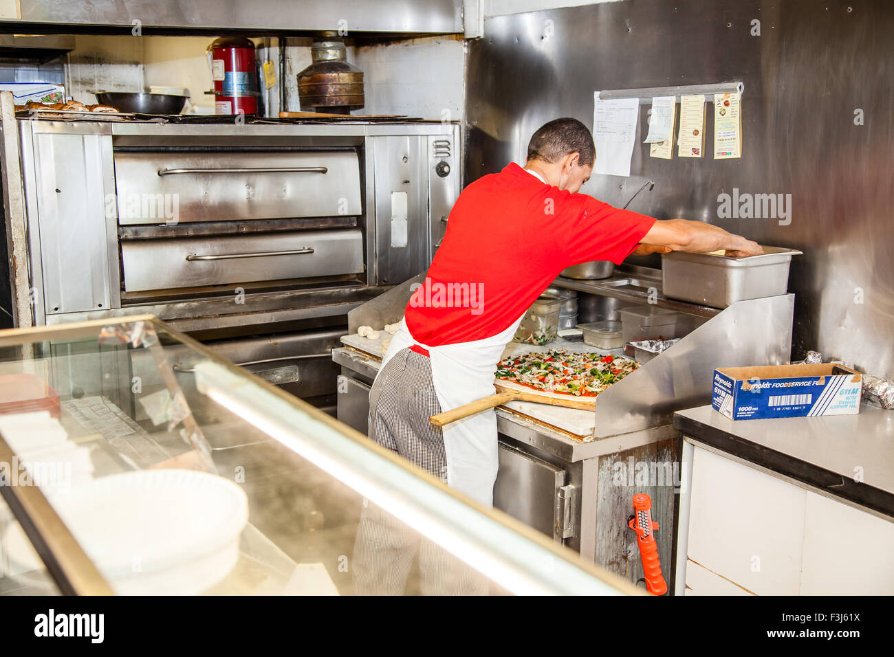 Pizza baker making fresh pizza in New York City Stock Photo - Alamy