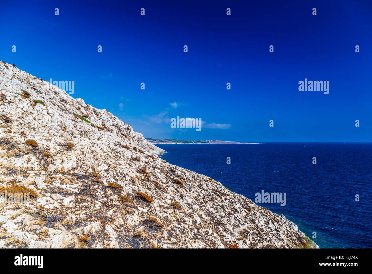 steep cliffs above the sea along the coast of Puglia in Italy Stock ...