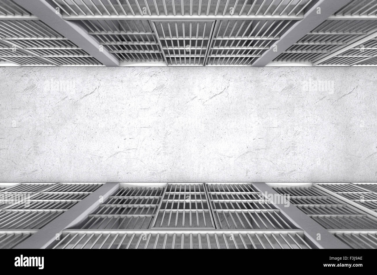 A direct top view of a row of closed jail cells between a concrete ...