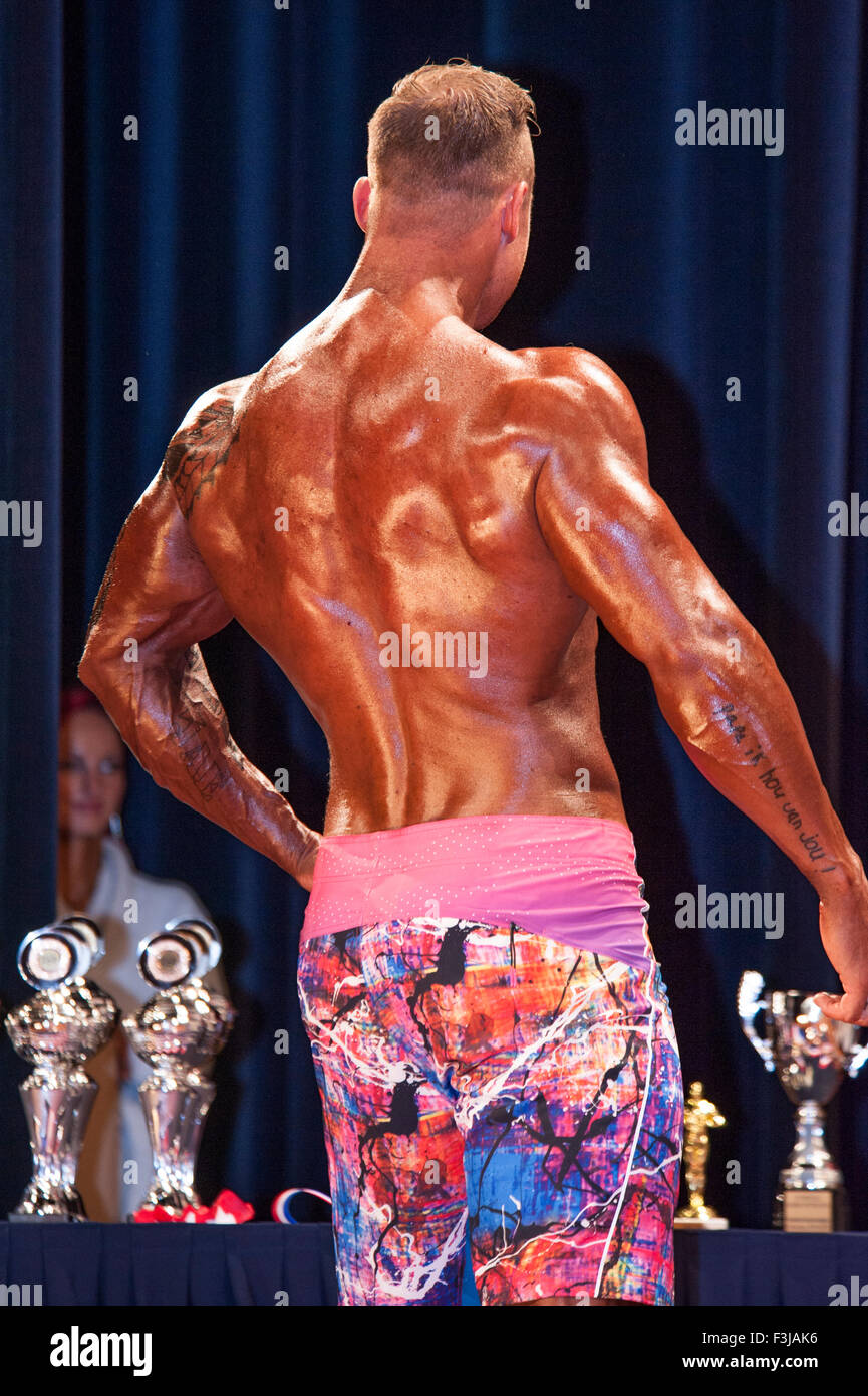 SCHIEDAM, THE NETHERLANDS - APRIL 26, 2015. Male bodybuilder shows his ...