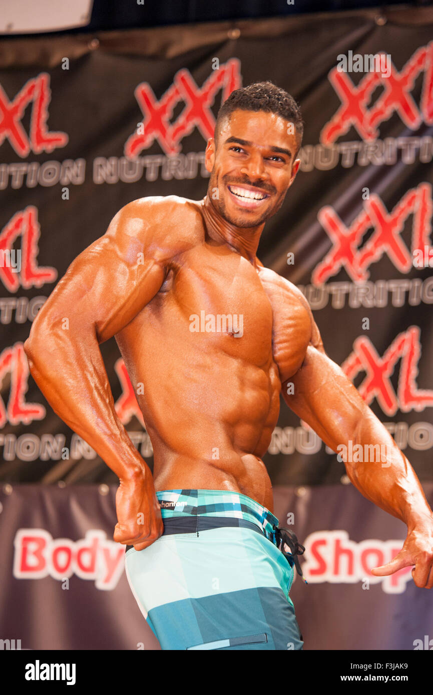 SCHIEDAM, THE NETHERLANDS - APRIL 26, 2015. Male bodybuilder shows his ...