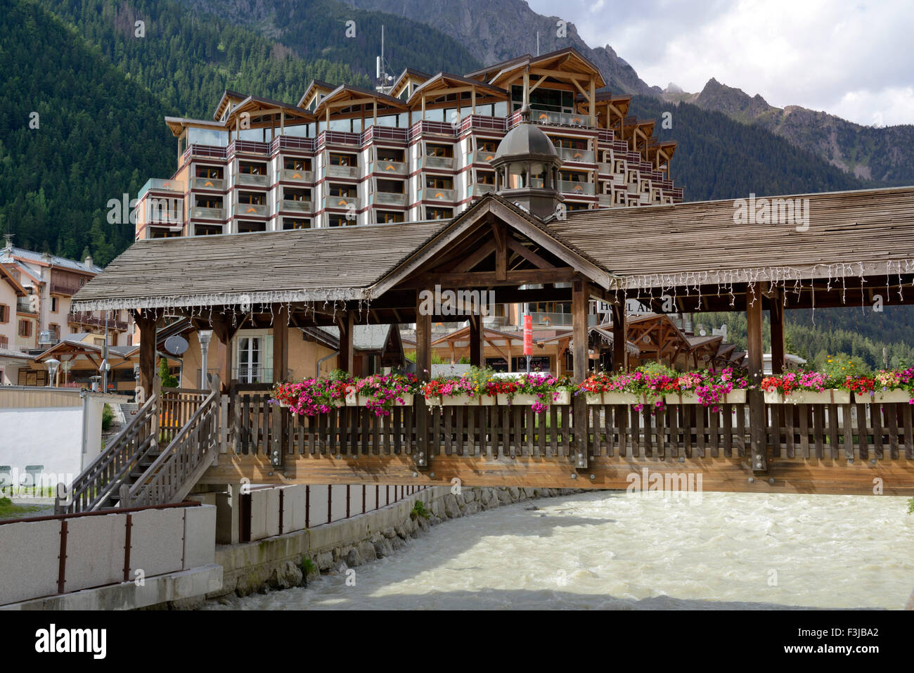 Flower bedecked footbridge over the River Arve, Chamonix Mont Blanc ...
