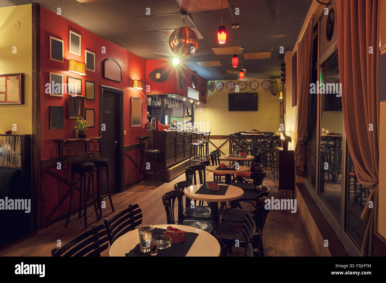 Interior of a modern cafe in retro style, night scene. Illumination ...