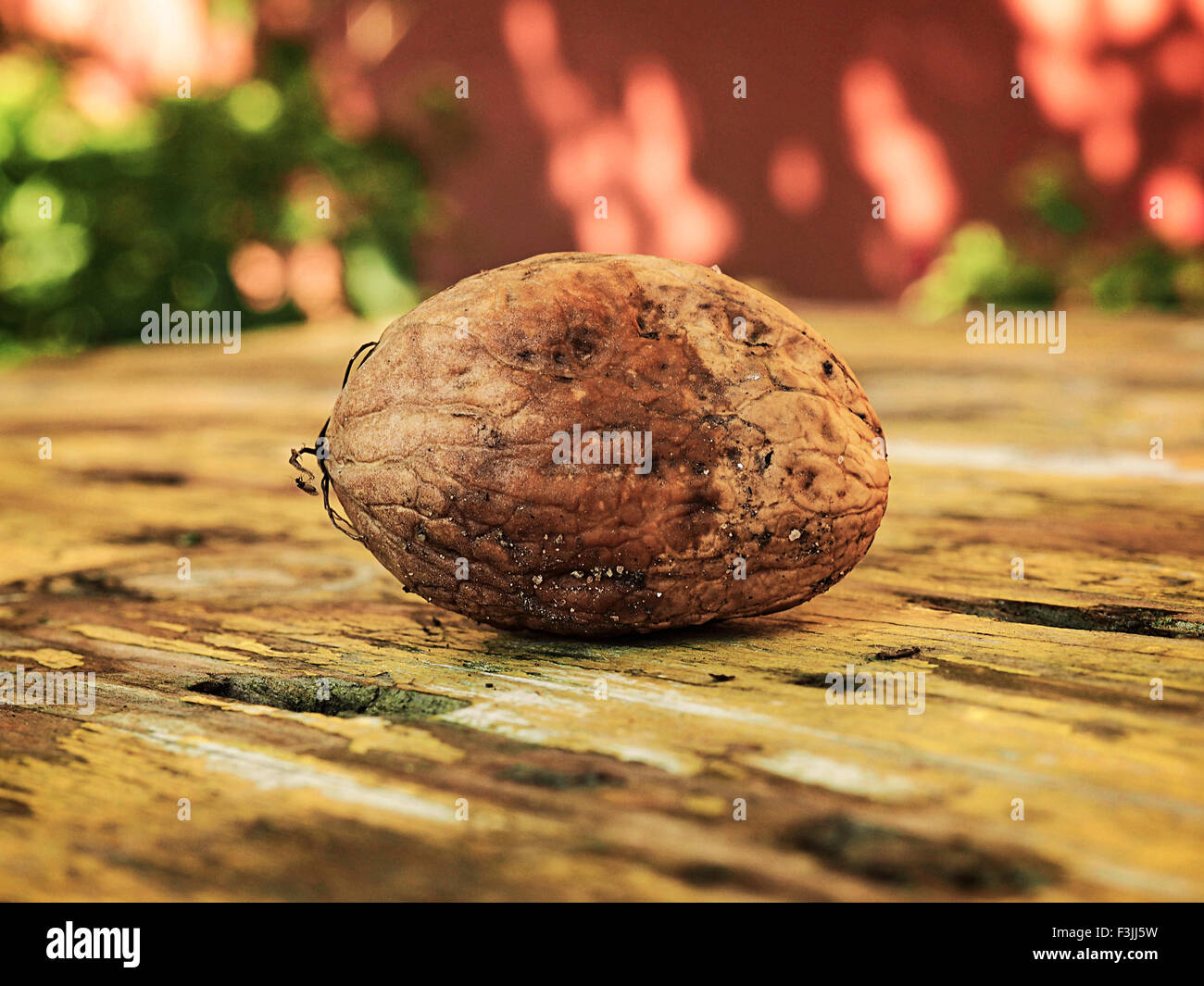 Walnut on rustic wooden table Stock Photo - Alamy