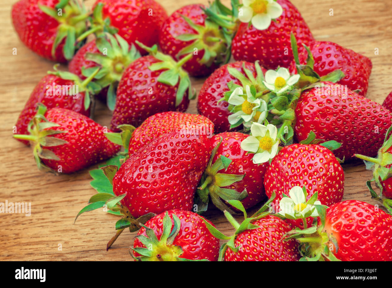 Strawberry on wooden table Stock Photo - Alamy