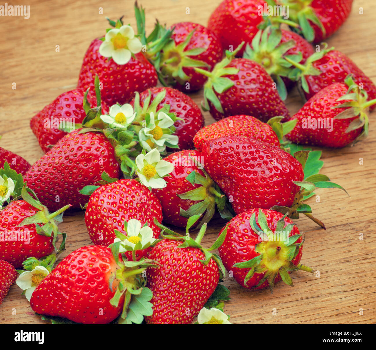 Strawberry on wooden table Stock Photo - Alamy
