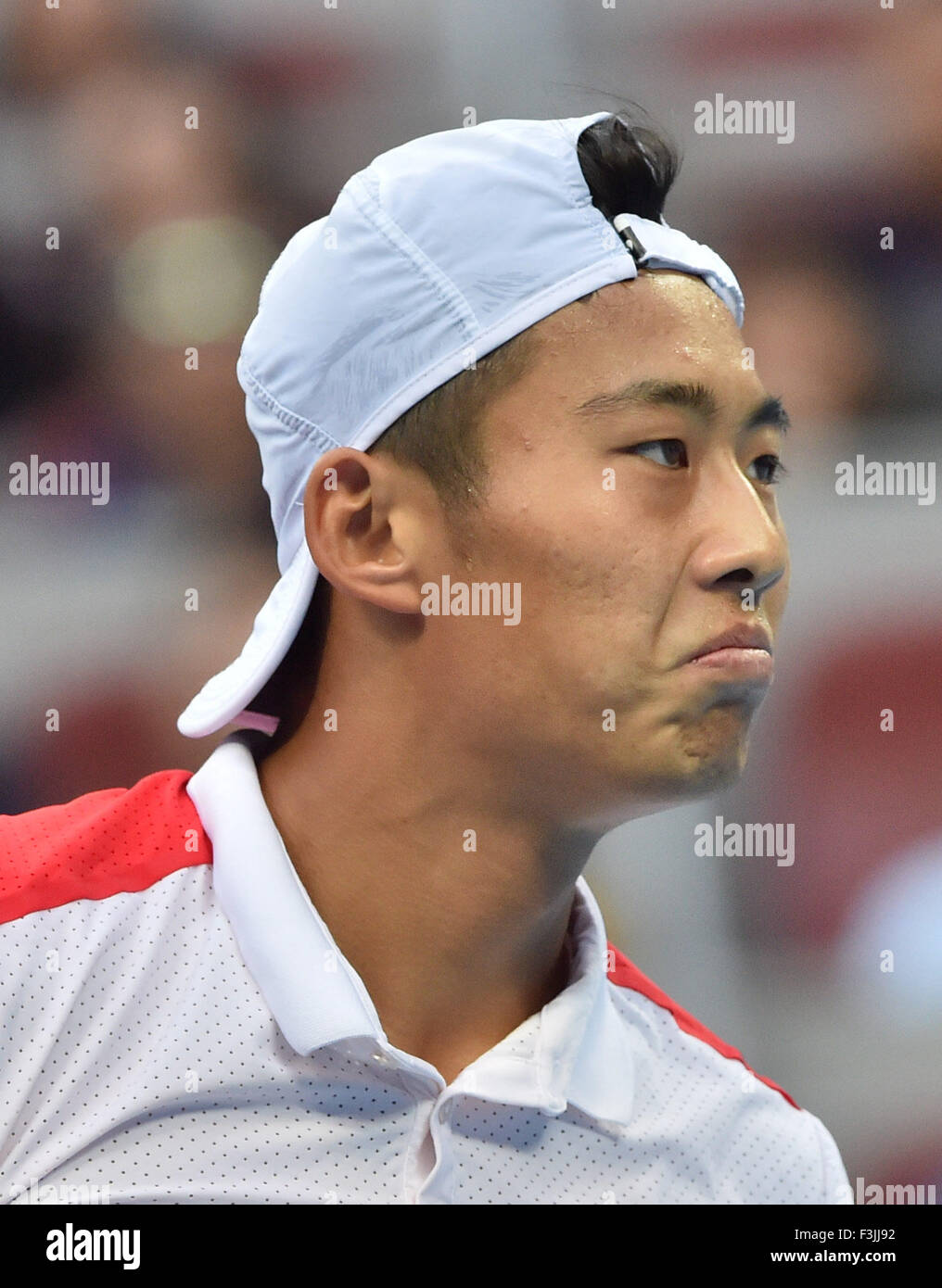Beijing, China. 8th Oct, 2015. Zhang Ze of China reacts during the men ...