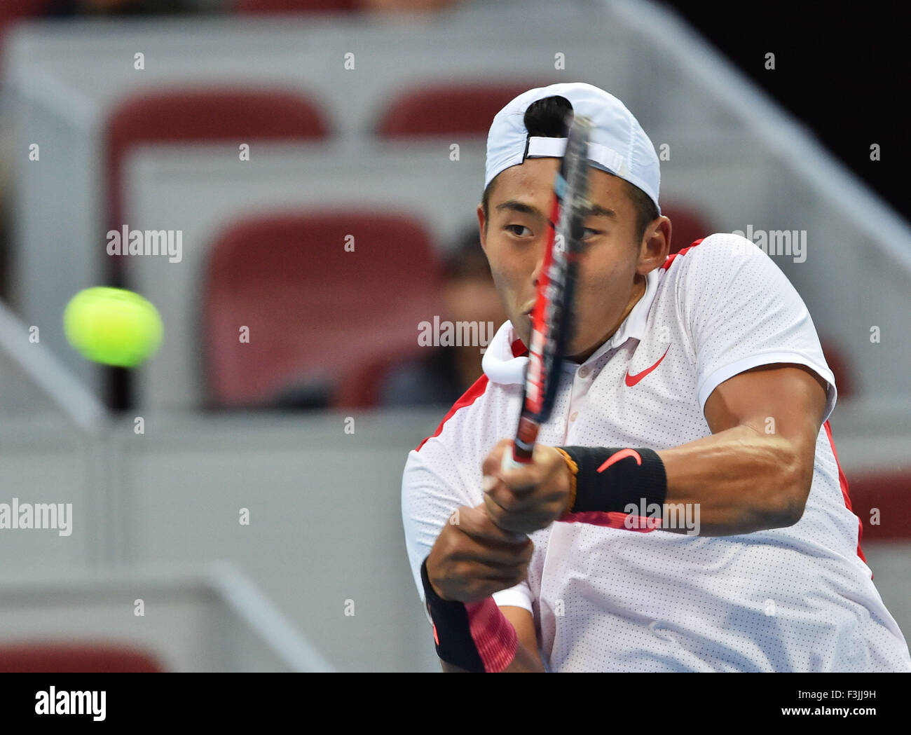 Beijing, China. 8th Oct, 2015. Zhang Ze of China hits a return to Novak ...