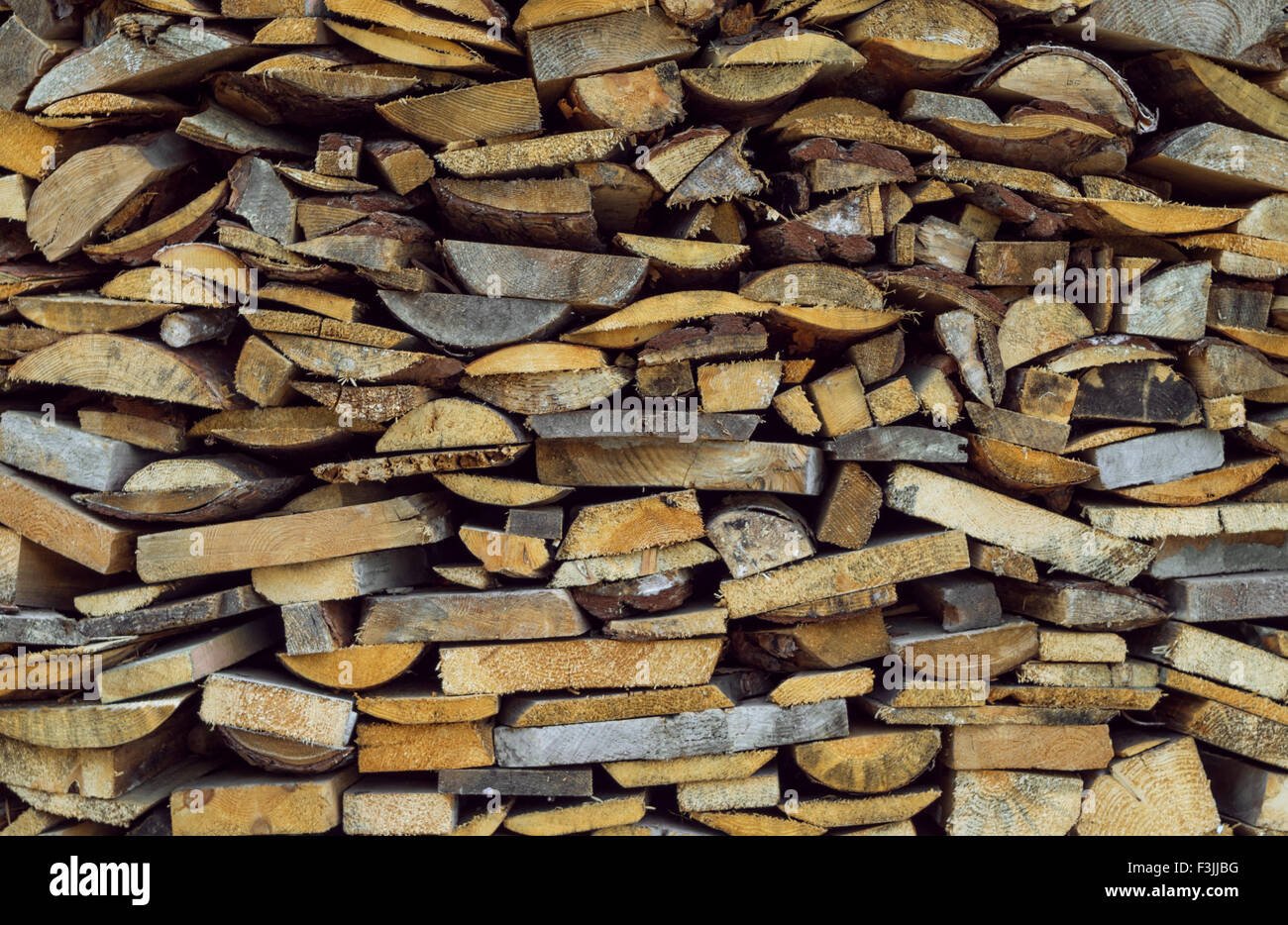 Stack of firewood, wood logs texture background Stock Photo - Alamy