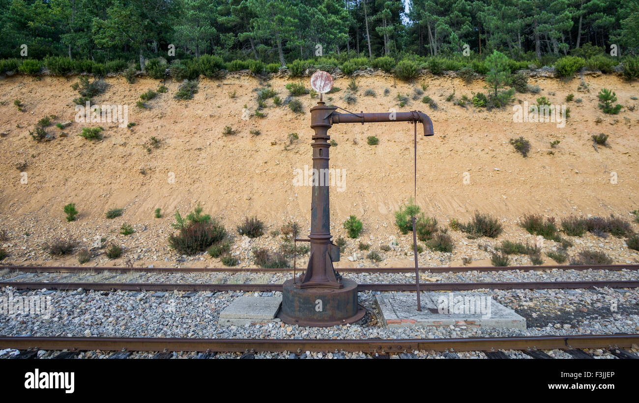 Vintage abandoned railroad water pump Stock Photo - Alamy