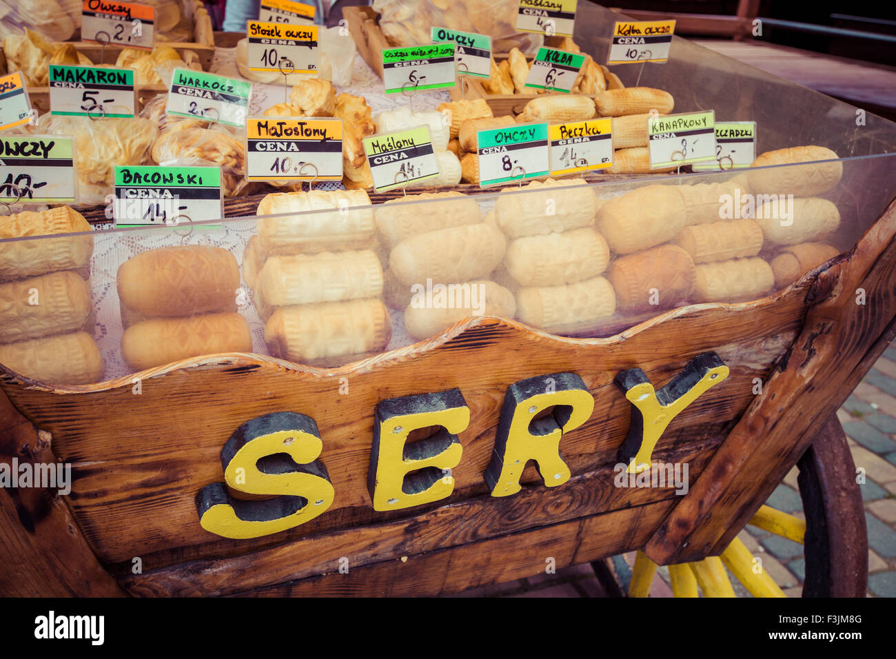 Traditional polish smoked cheese oscypek on outdoor market in Zakopane ...