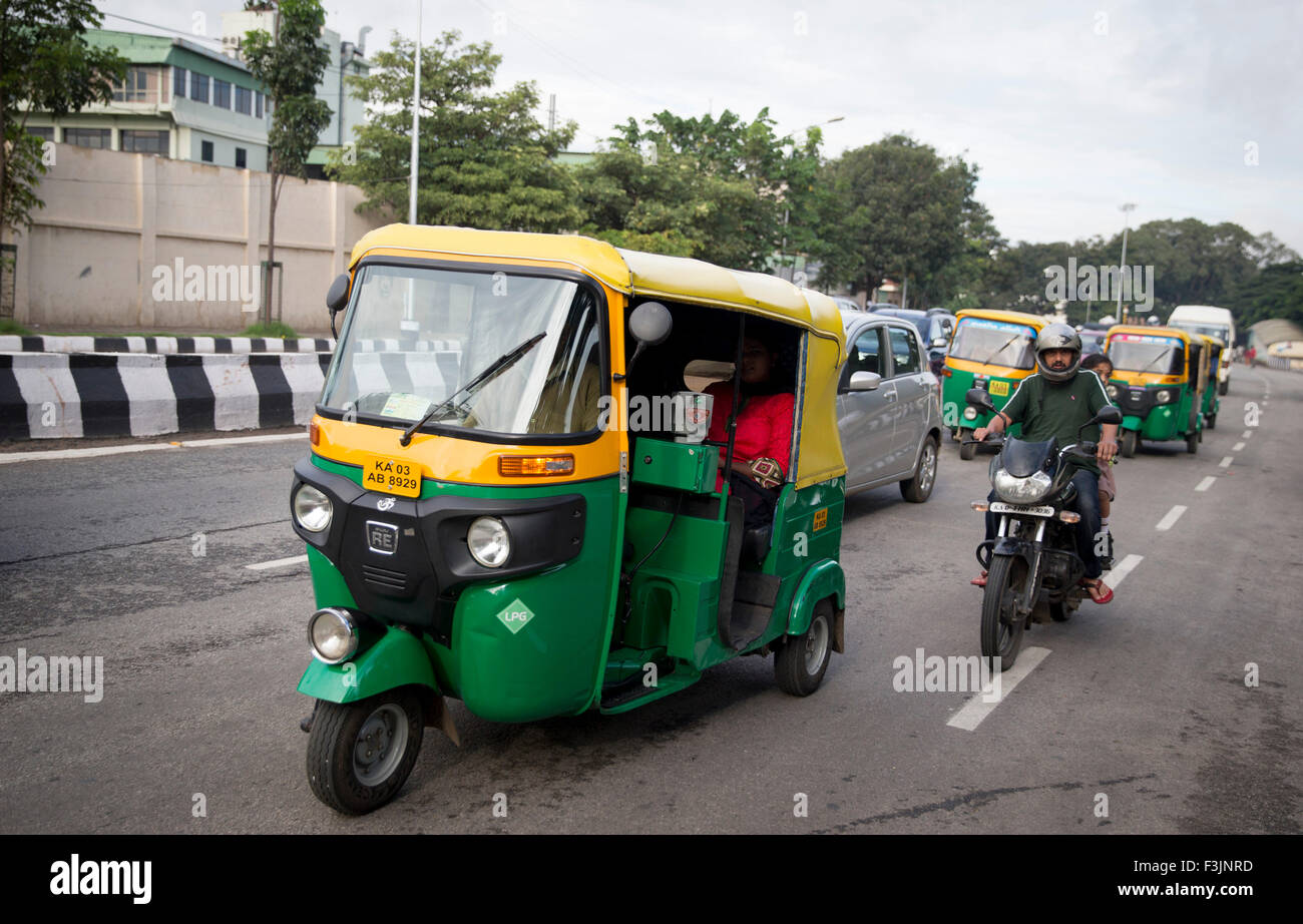 Bangalore, India. 06th Oct, 2015. Motorcycles and rickshaws make their ...
