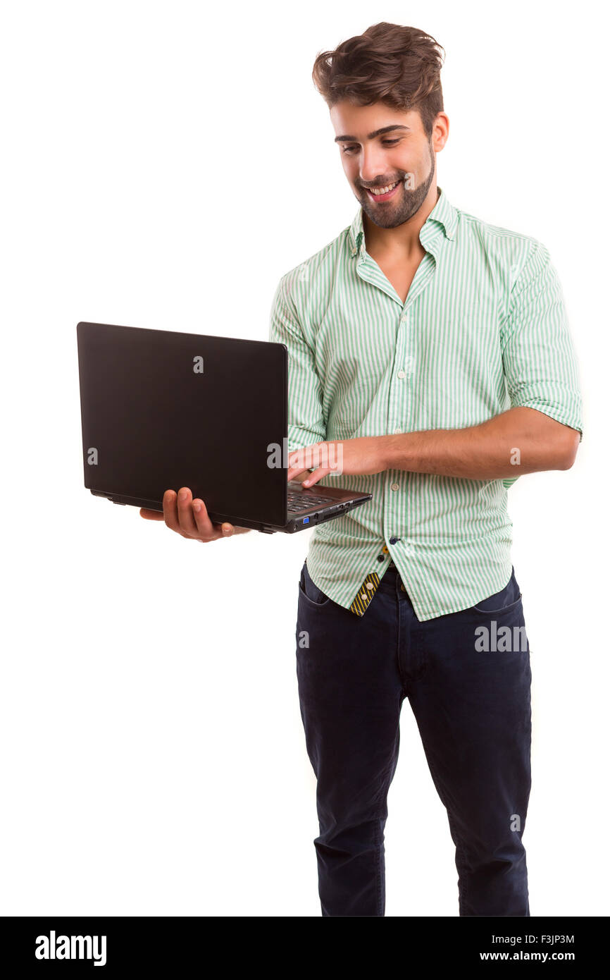 Young handsome man working with laptop computer Stock Photo - Alamy