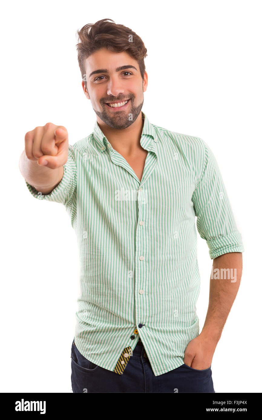 Handsome young man pointing at you, isolated over white background ...