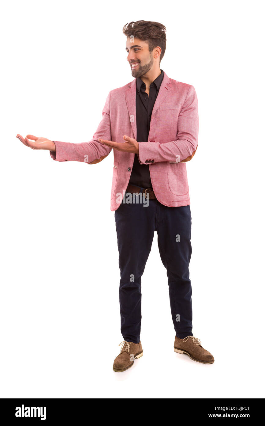Young man presenting your product, isolated over a white background ...