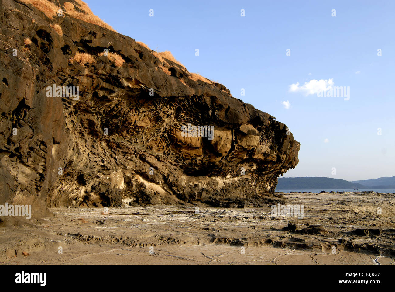 sea waves erosion on igneous rock lava volcano Harihareshwar Beach ...