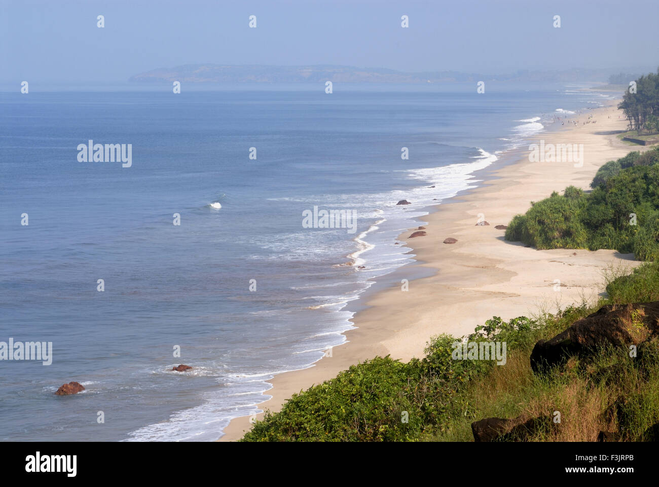 Blue water of Arabian sea with greenery Long Ganapatipule Beach ...