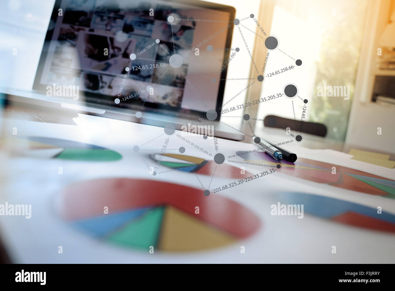 Office workplace with laptop and pen and business document with social ...