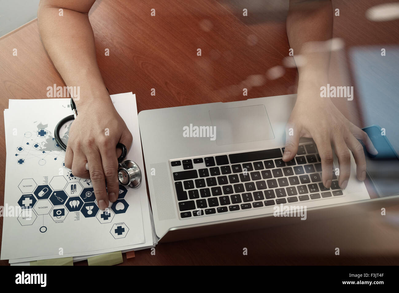 top view of Medicine doctor hand working with modern computer and smart ...