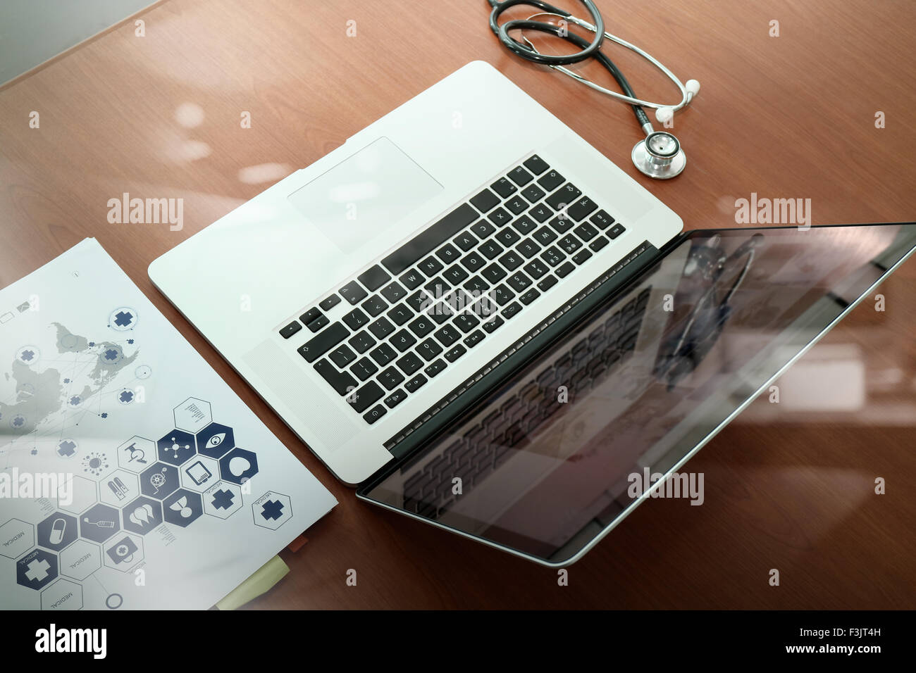 top view of Medicine doctor hand working with modern computer and smart ...