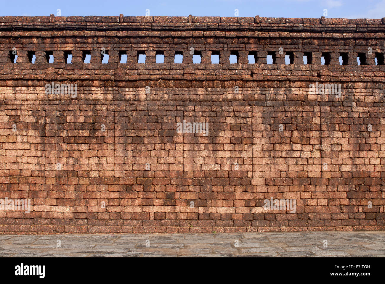 old stone brick wall around Gomateshawara situated on Gommata Betta at ...