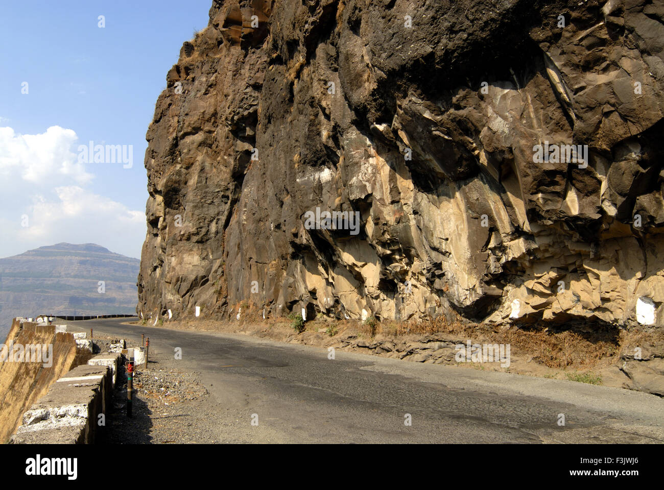 Zigzag Ghat road constructed by cutting very hard black rock of ...