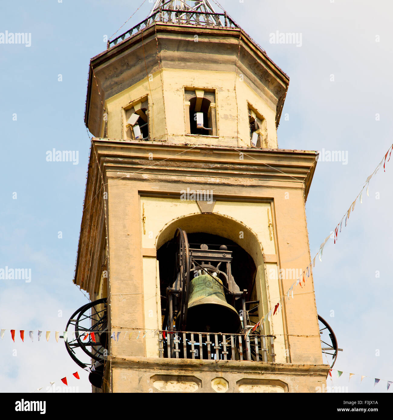 ancien clock tower in italy europe old stone and bell Stock Photo - Alamy
