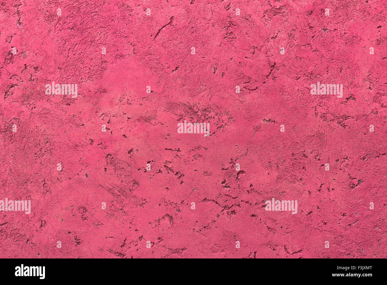 Front view of a wall decorated with pink plaster Stock Photo - Alamy