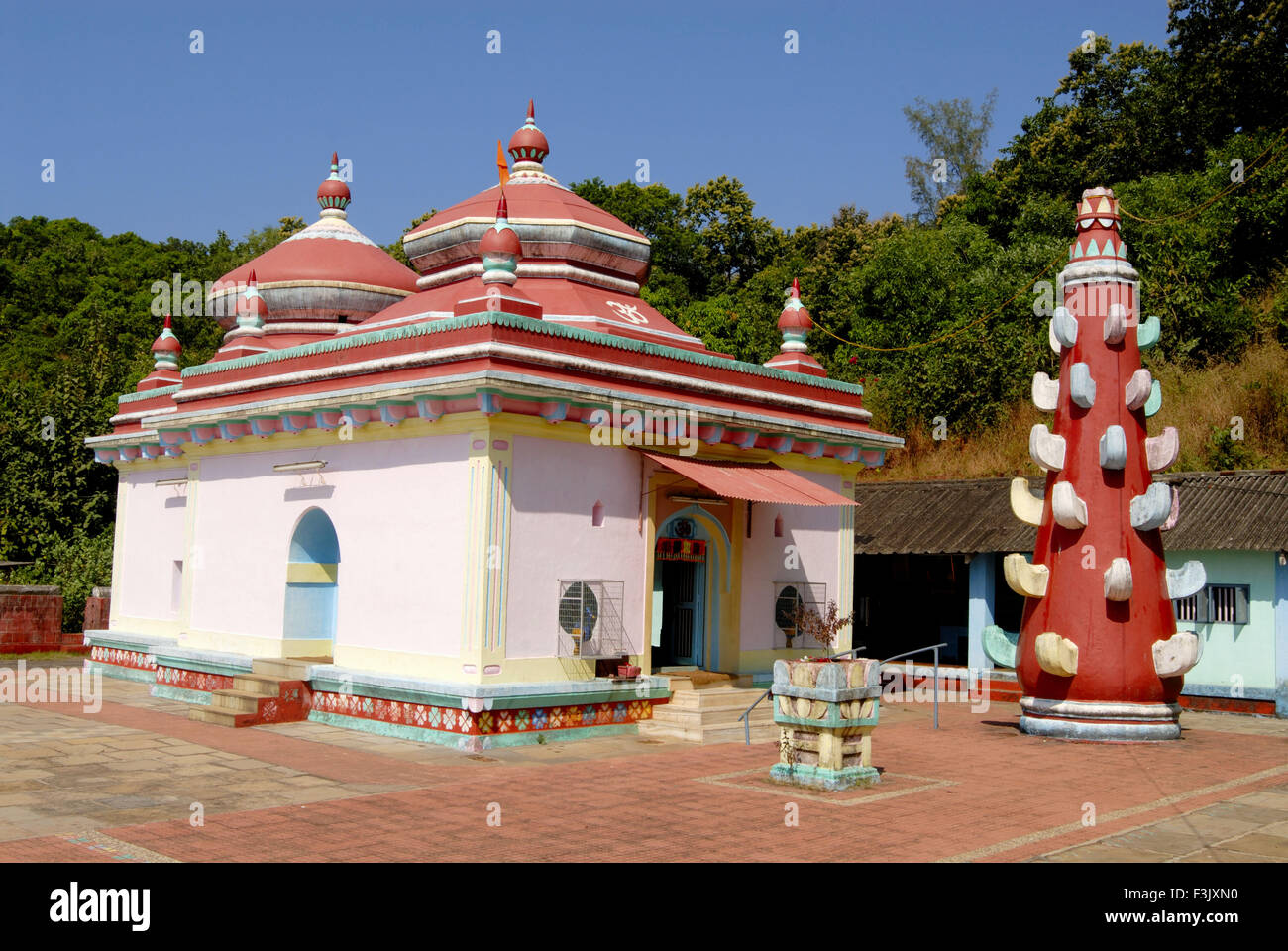 Shri Dasabhuj Lakshmi Ganesh temple with colorful lamppost ; Deepmal at ...
